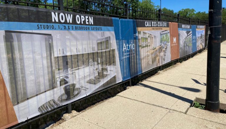 Why Construction Fence Banners Attract Local Interest